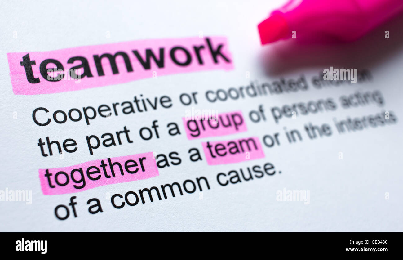 Definition of teamwork, highlighted in colour Stock Photo - Alamy