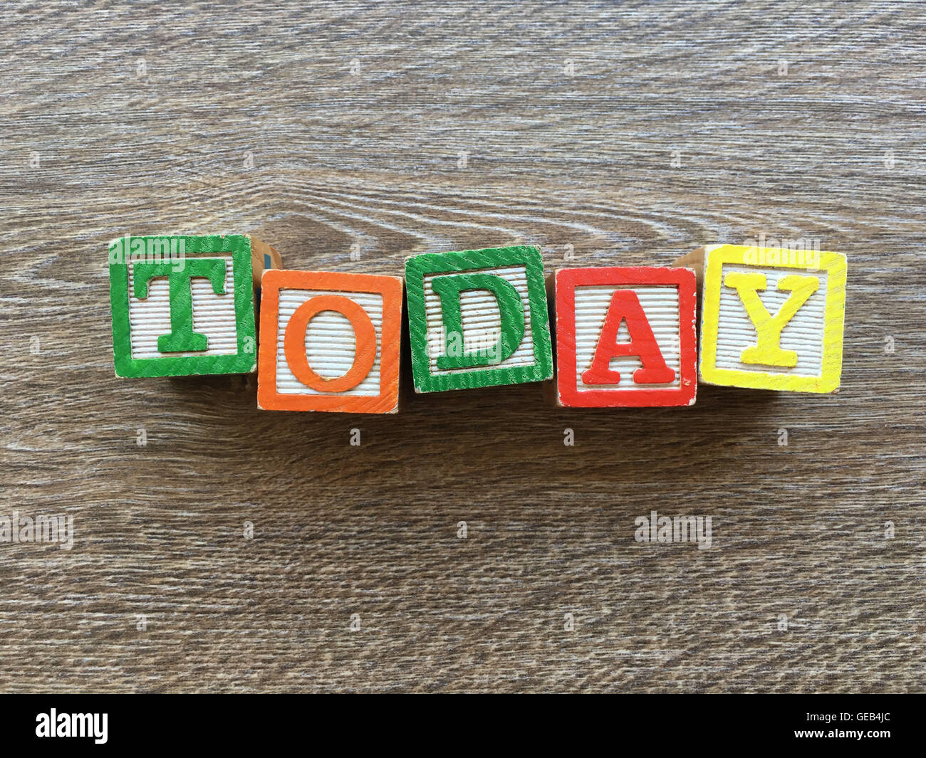 Alphabet wood block letters forming the word TODAY, combining those ...
