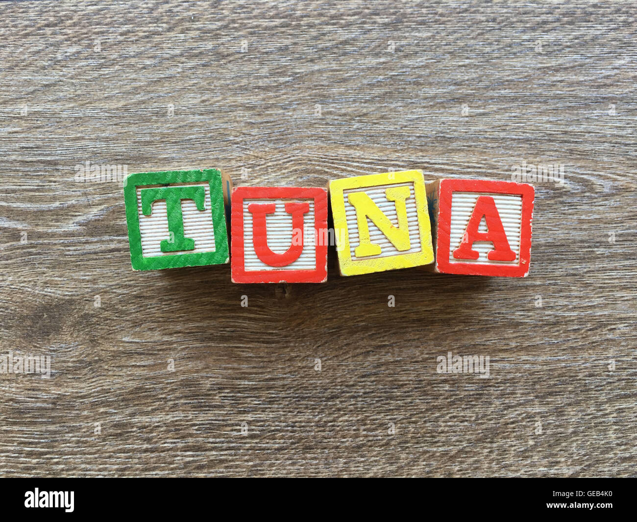 Alphabet wood block letters forming the word TUNA, combining those toys ...