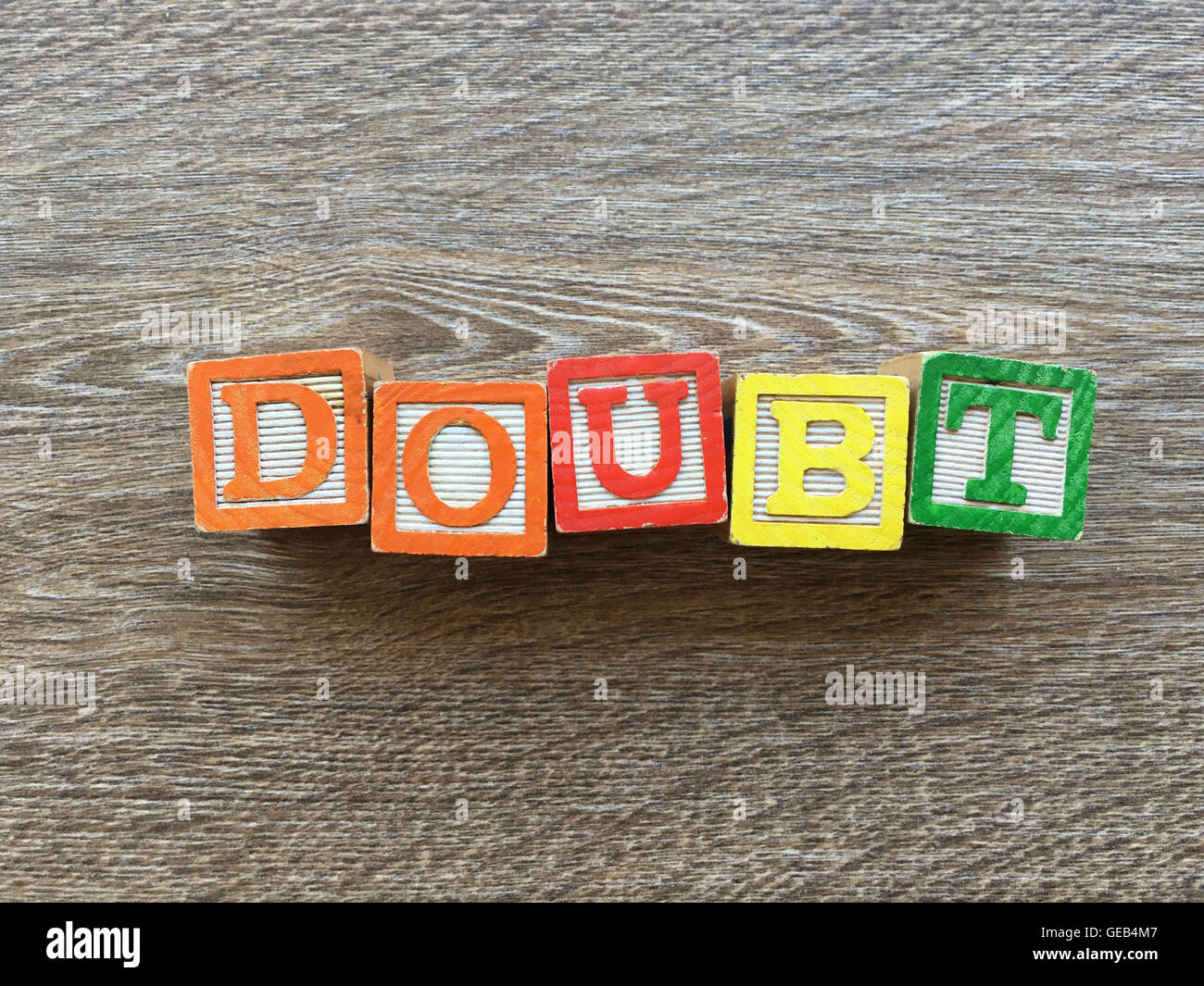 Alphabet wood block letters forming the word DOUBT, combining those ...