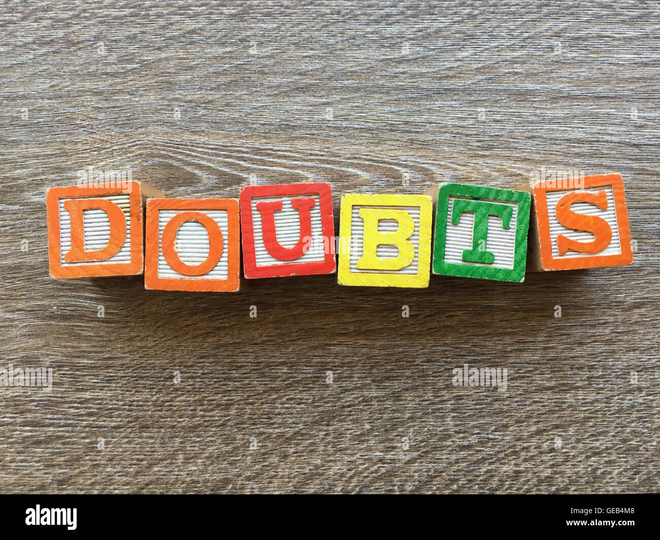 Alphabet wood block letters forming the word DOUBT, combining those ...