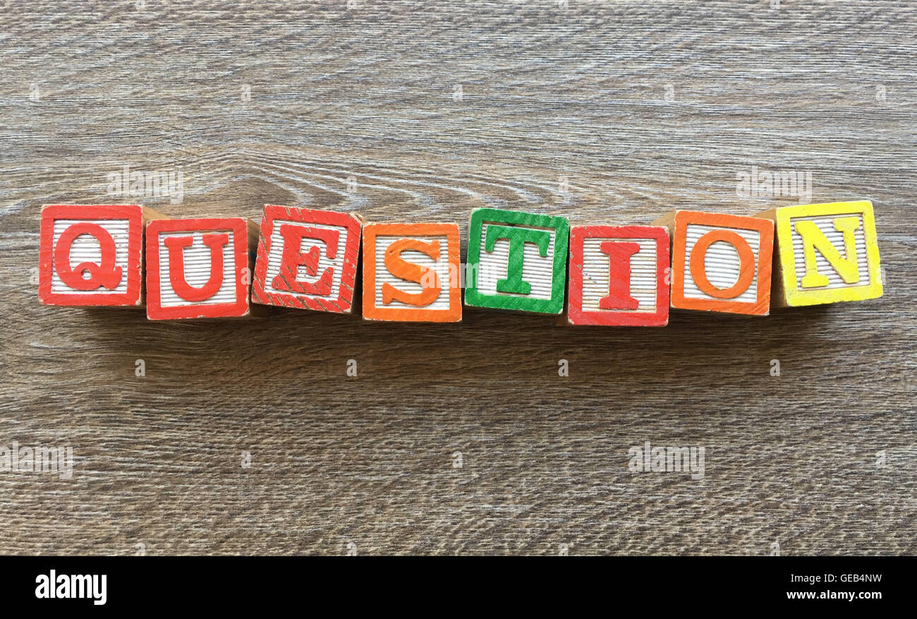 Alphabet wood block letters forming the word QUESTION, combining those ...