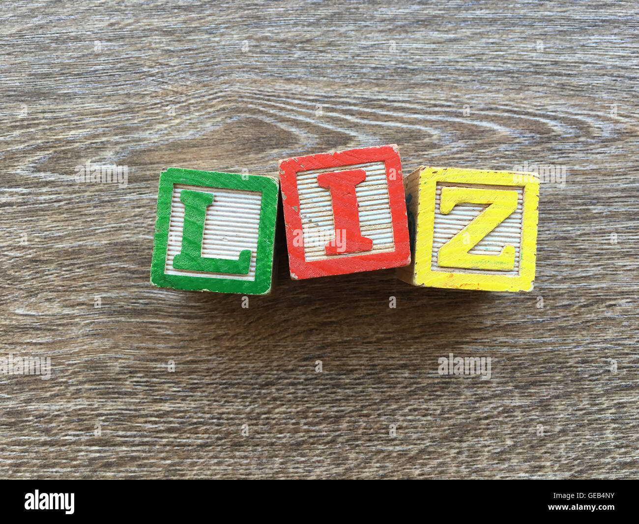 LIZ name written with wood block characters Stock Photo - Alamy