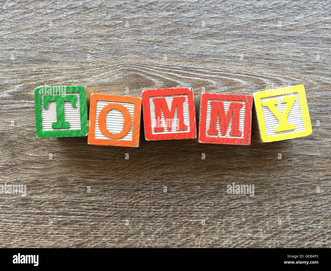 TOMMY name written with wood block characters Stock Photo - Alamy