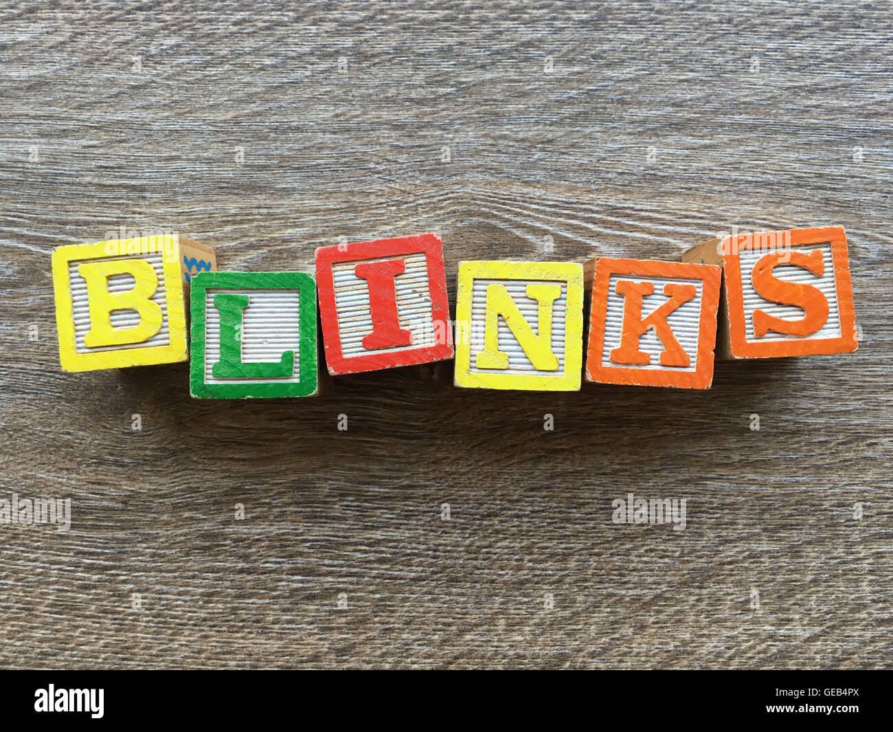 Alphabet wood block letters forming the word BLINKS, it is a way for ...