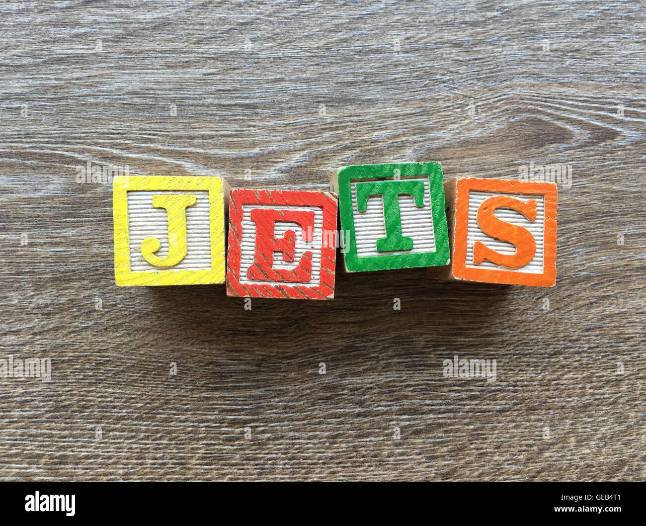 Alphabet wood block letters forming the word JETS, combining those toys ...
