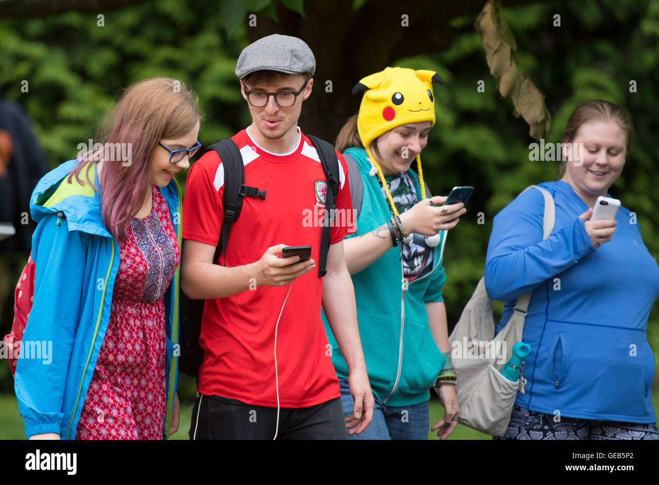 Pokemon GO players play Pokemon on their mobile phones in parks in ...