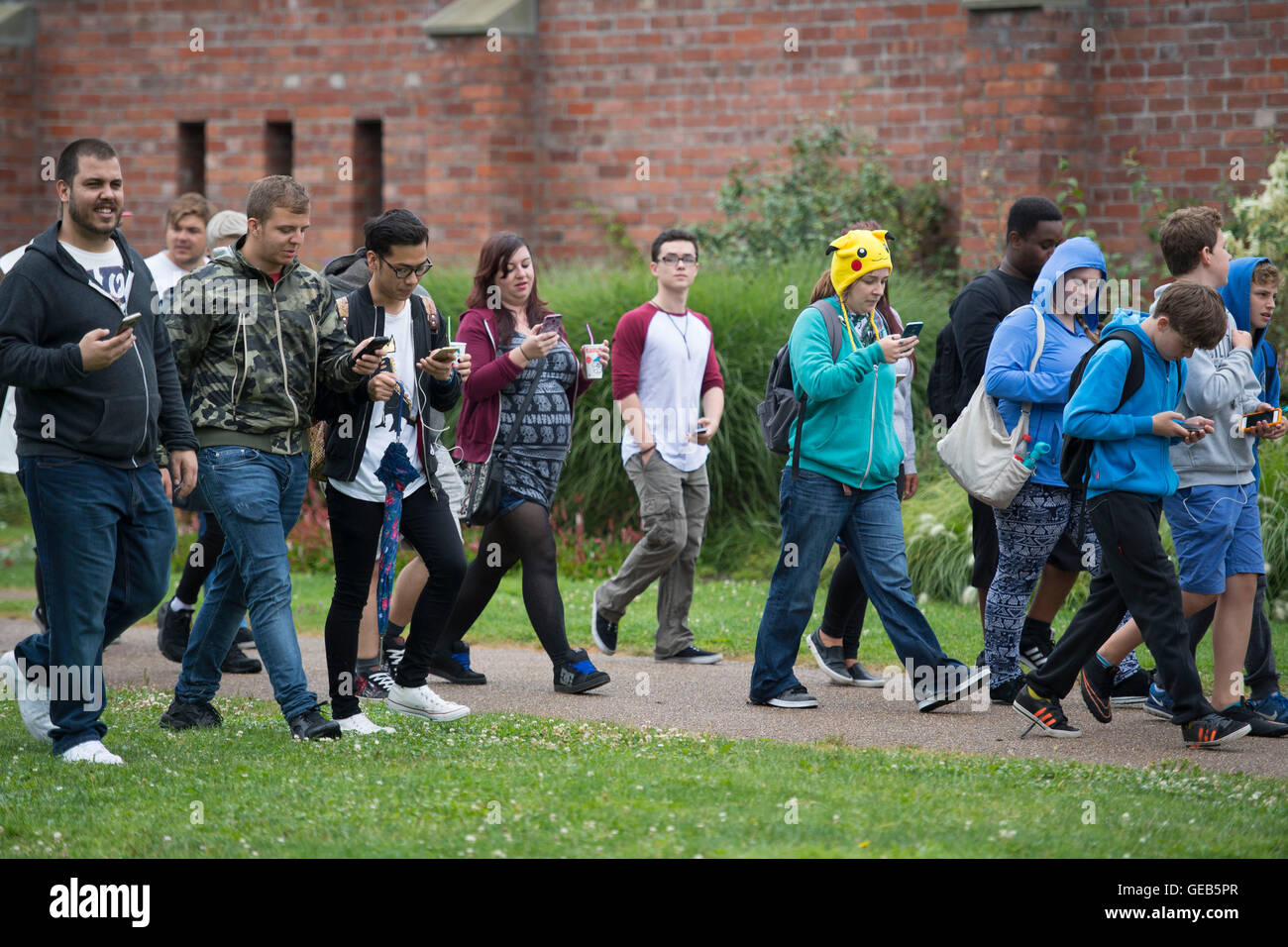 Pokemon GO players play Pokemon on their mobile phones in parks in ...