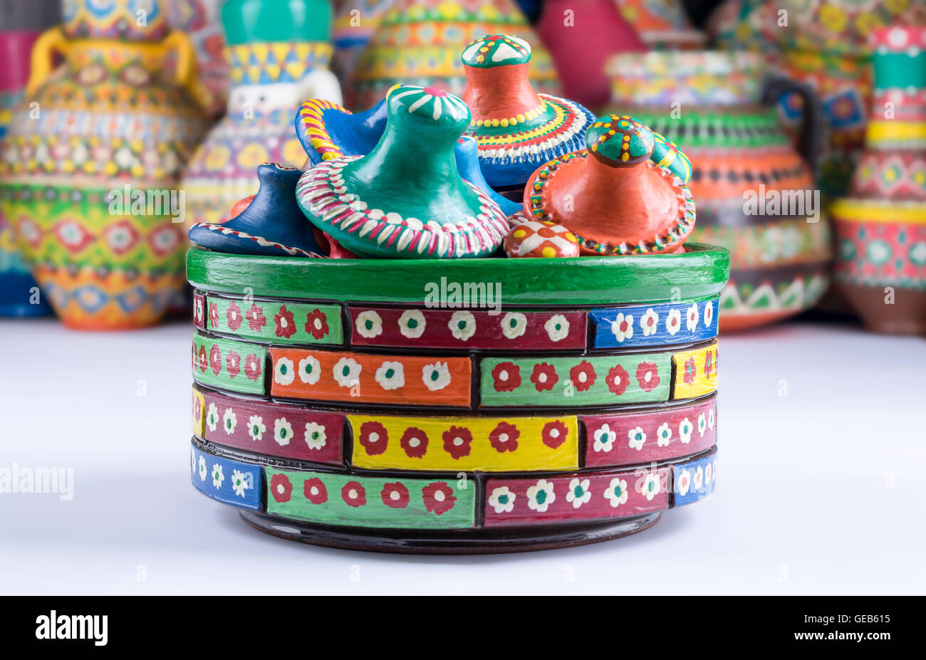 Composition of artistic handcrafted painted pottery containers Stock ...