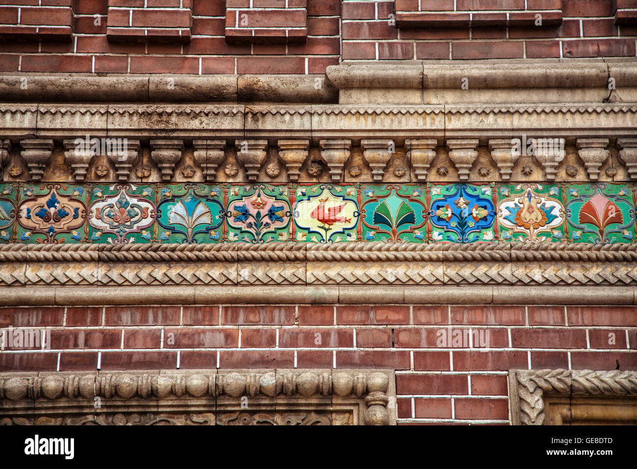 The outer wall of an old building with beautiful bas-relief Stock Photo ...