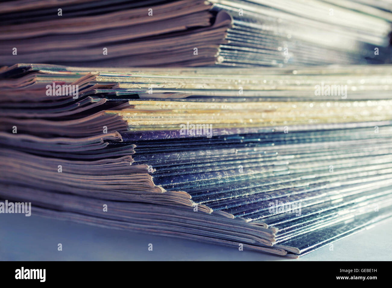 Large stack of magazines on table close-up Stock Photo - Alamy