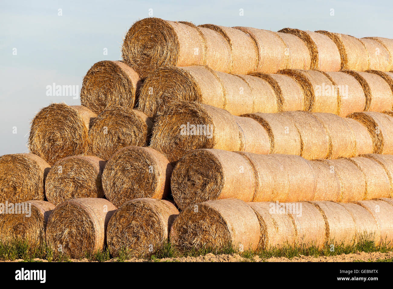 stack of straw in the field Stock Photo - Alamy