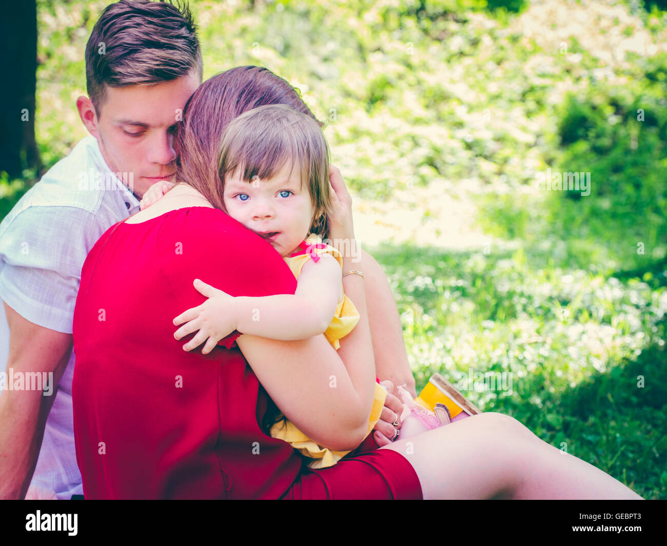 Mother holding her crying cute baby girl Stock Photo - Alamy