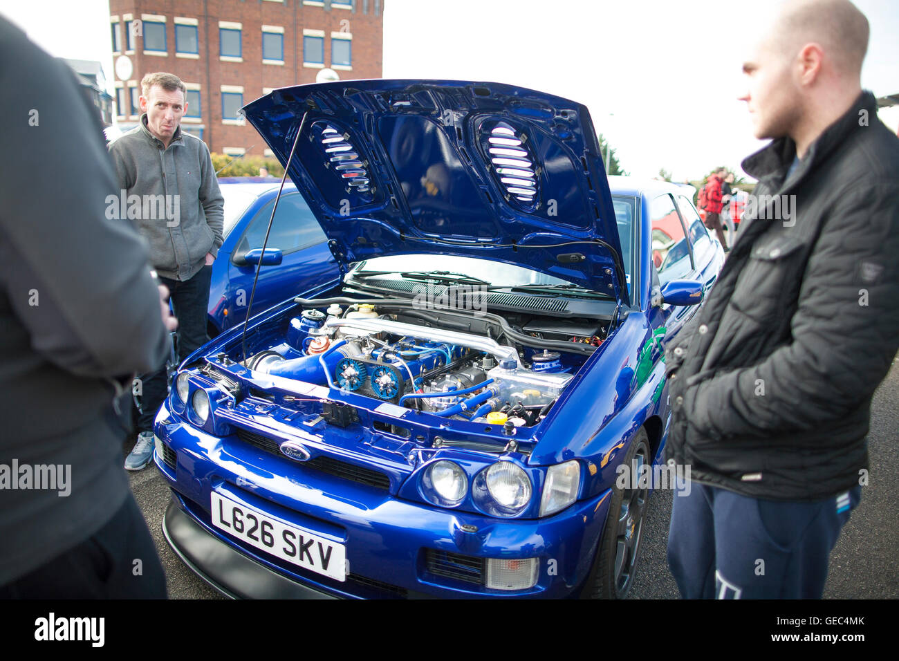 A souped up Subaru motor car with a high performance engine is admired ...