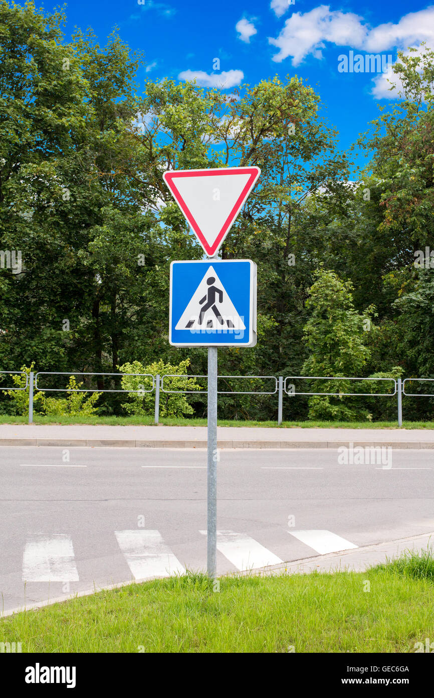 Give way and cross road sign in the residential area Stock Photo - Alamy