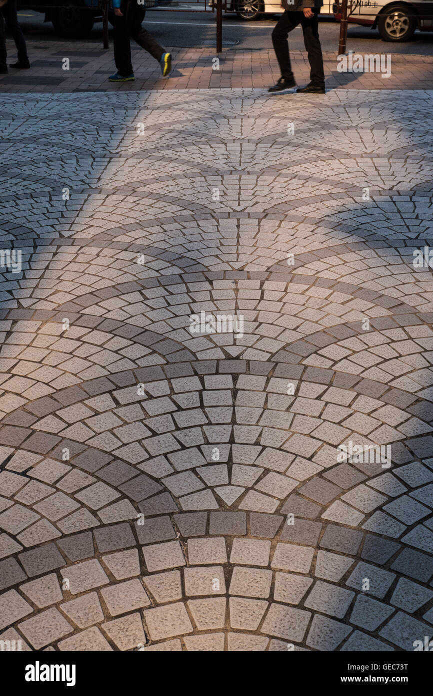 Graphic design in pavement Stock Photo - Alamy