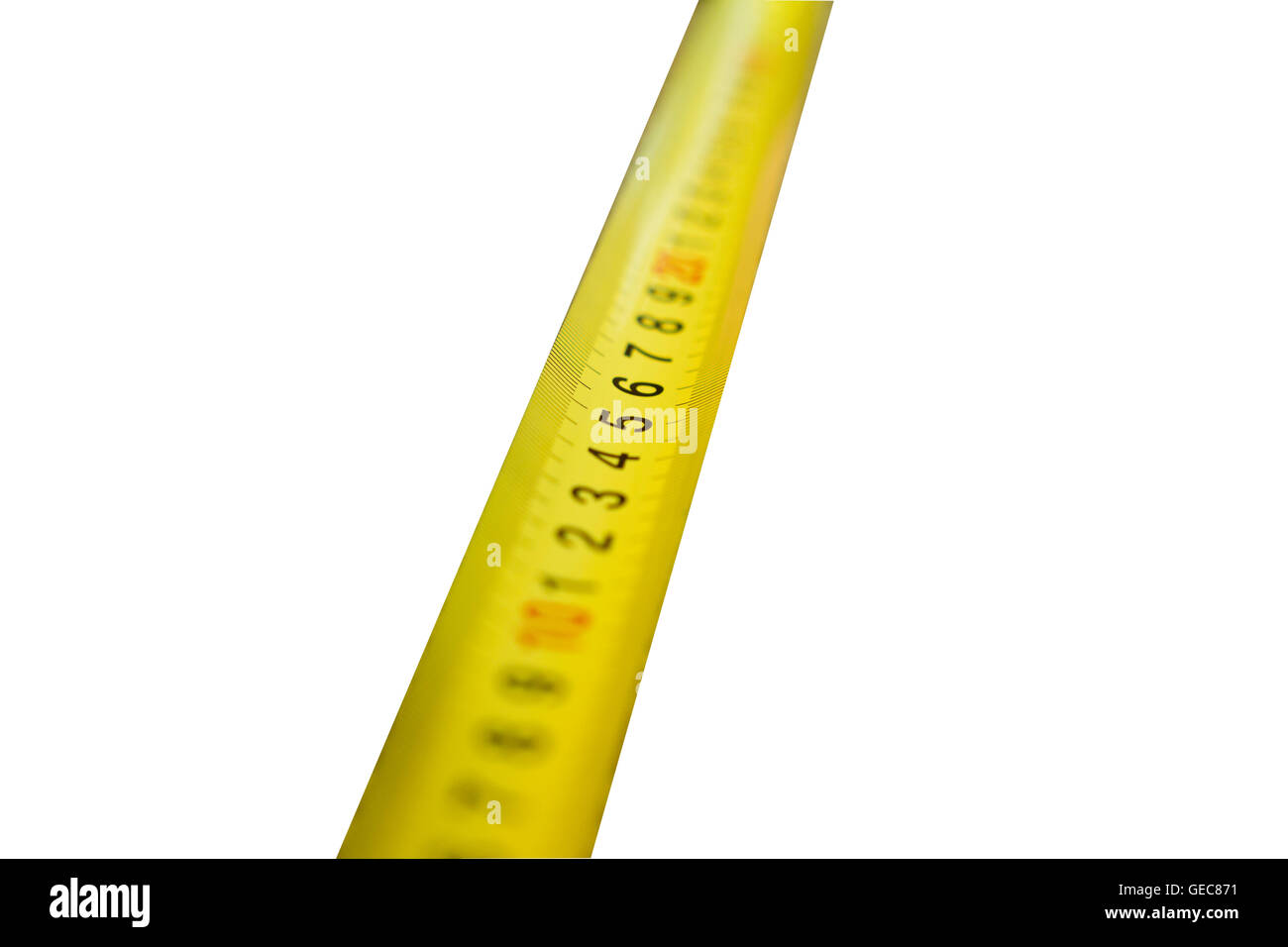 Yellow folding measuring tool on a white background Stock Photo - Alamy