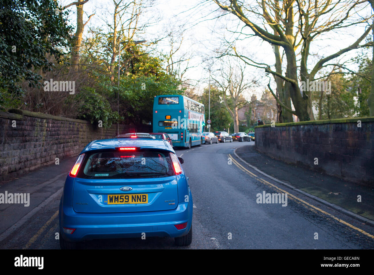 Cars queue at a traffic light at the junction of Queens drive and North ...