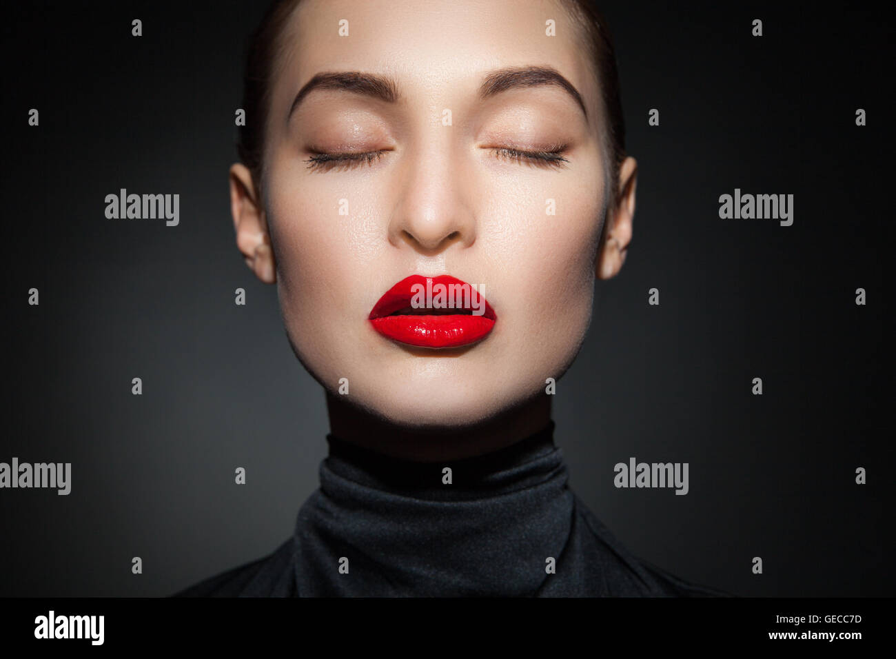 Close-up of sensual model with red lips and eyes closed Stock Photo - Alamy