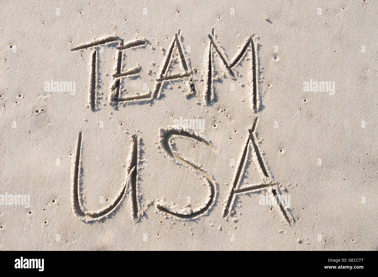 Message for Team USA written in smooth sand on the beach in Rio de ...