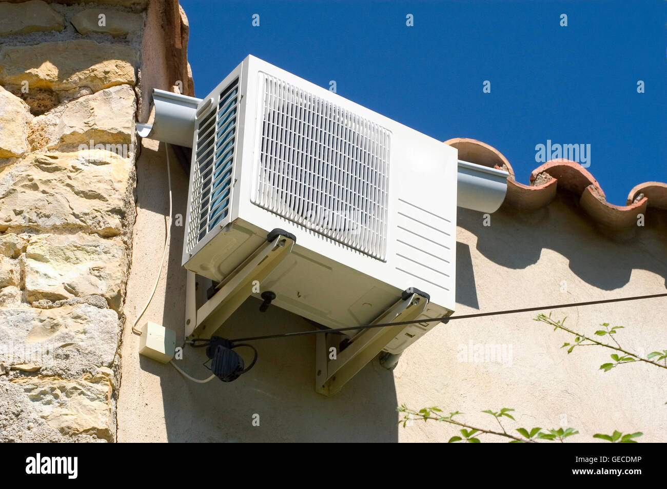 air conditioning system on an old stone house in southern France Stock ...
