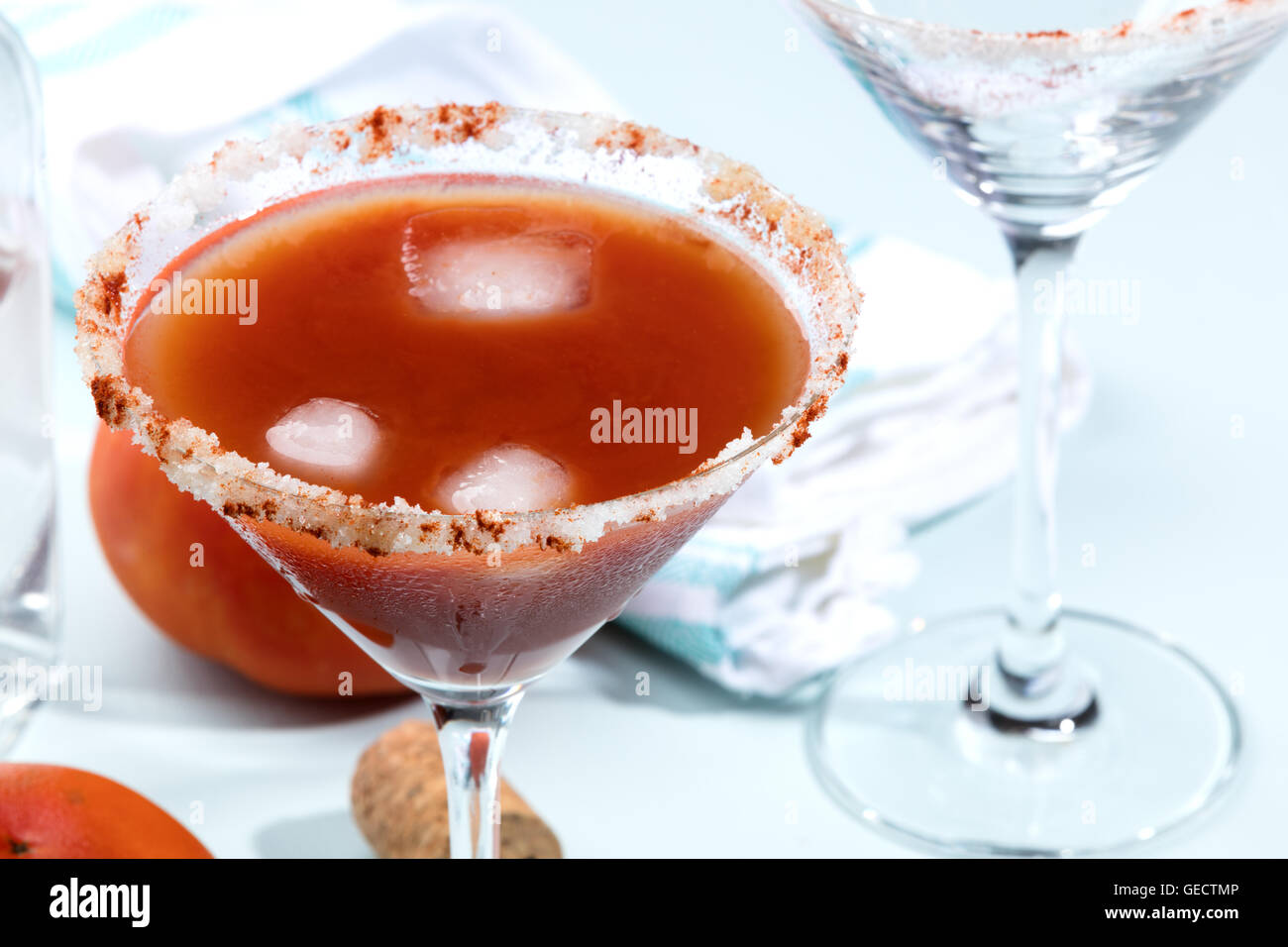 Bloody Mary cocktails on a blue wooden table Stock Photo - Alamy