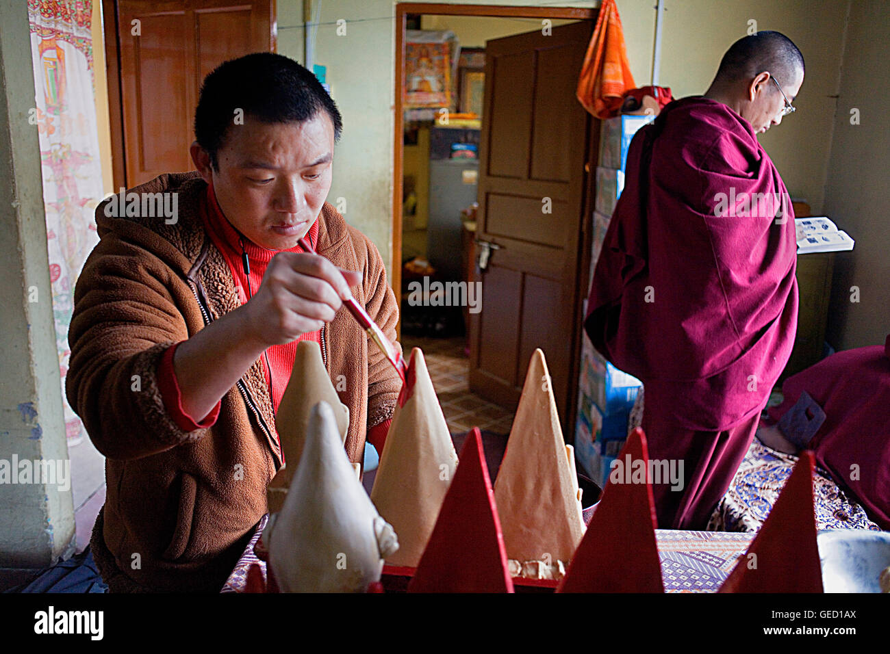 Monk making offerings, in Gaden Shartse monastery.McLeod Ganj ...