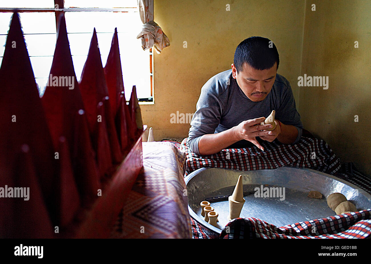 Monk making offerings, in Gaden Shartse monastery.McLeod Ganj ...