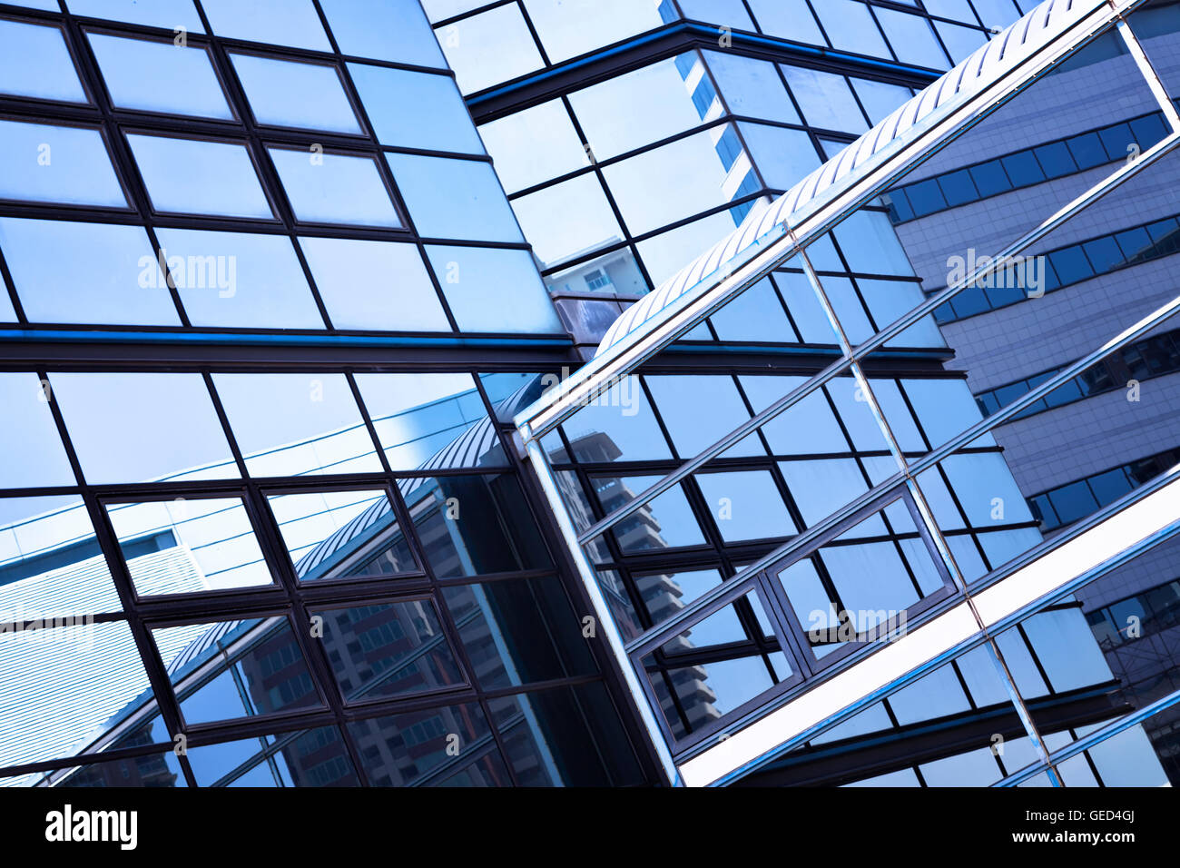 Modern architecture in Tokyo,glass wall background of an office building Stock Photo - Alamy