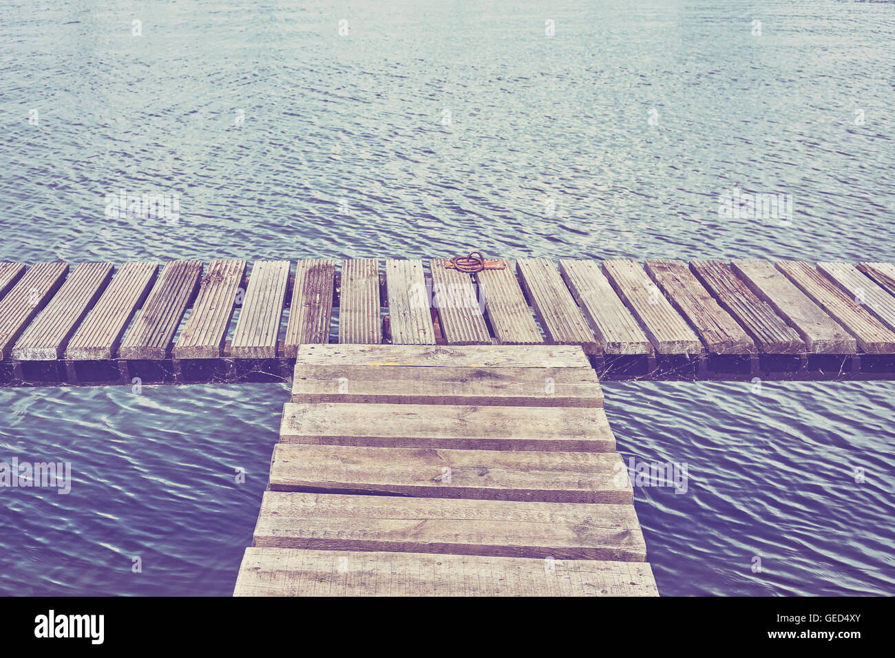 Vintage toned old wooden pier Stock Photo - Alamy