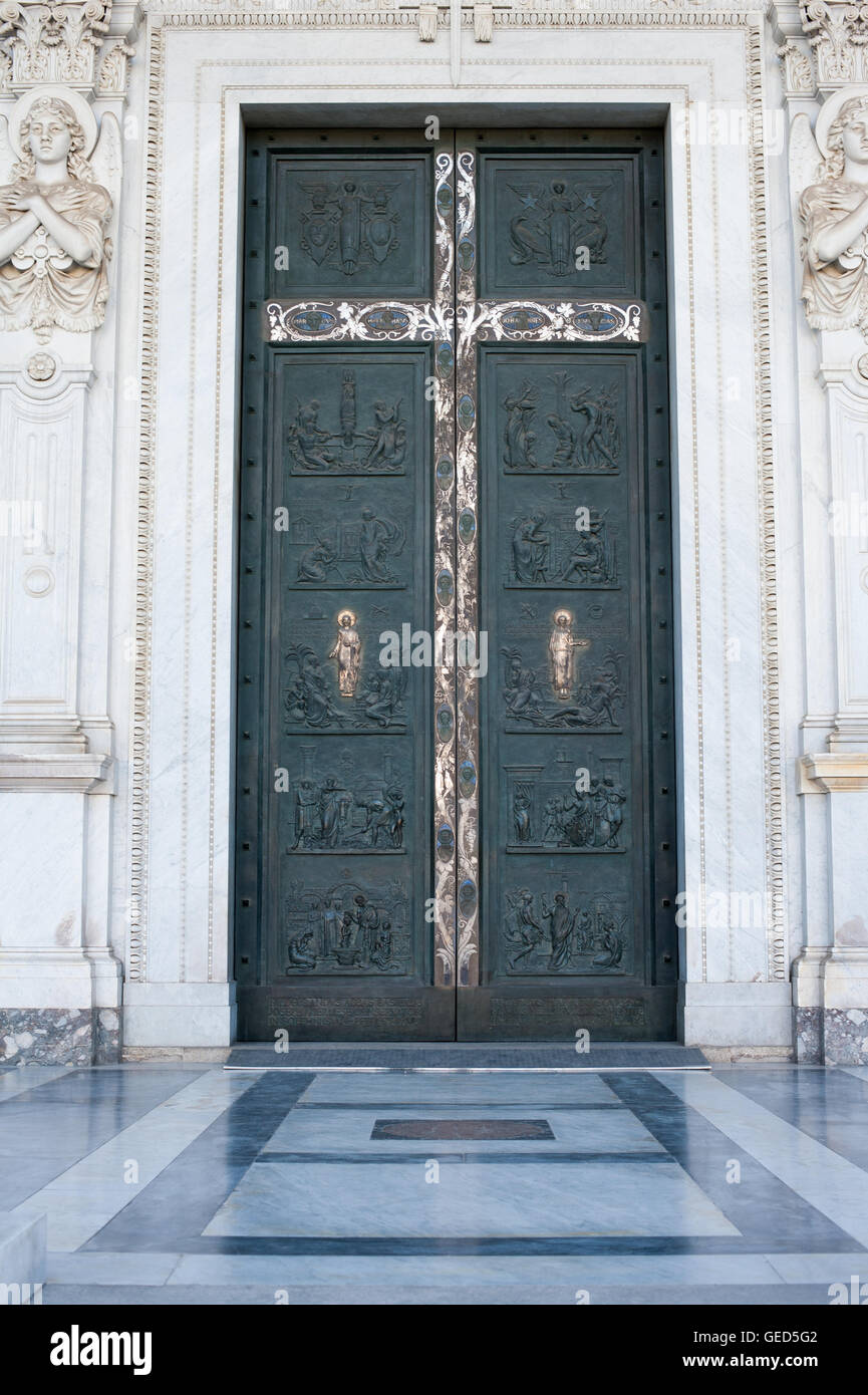 St Paul basilica holy door in Rome, closed door with big cross of the ...