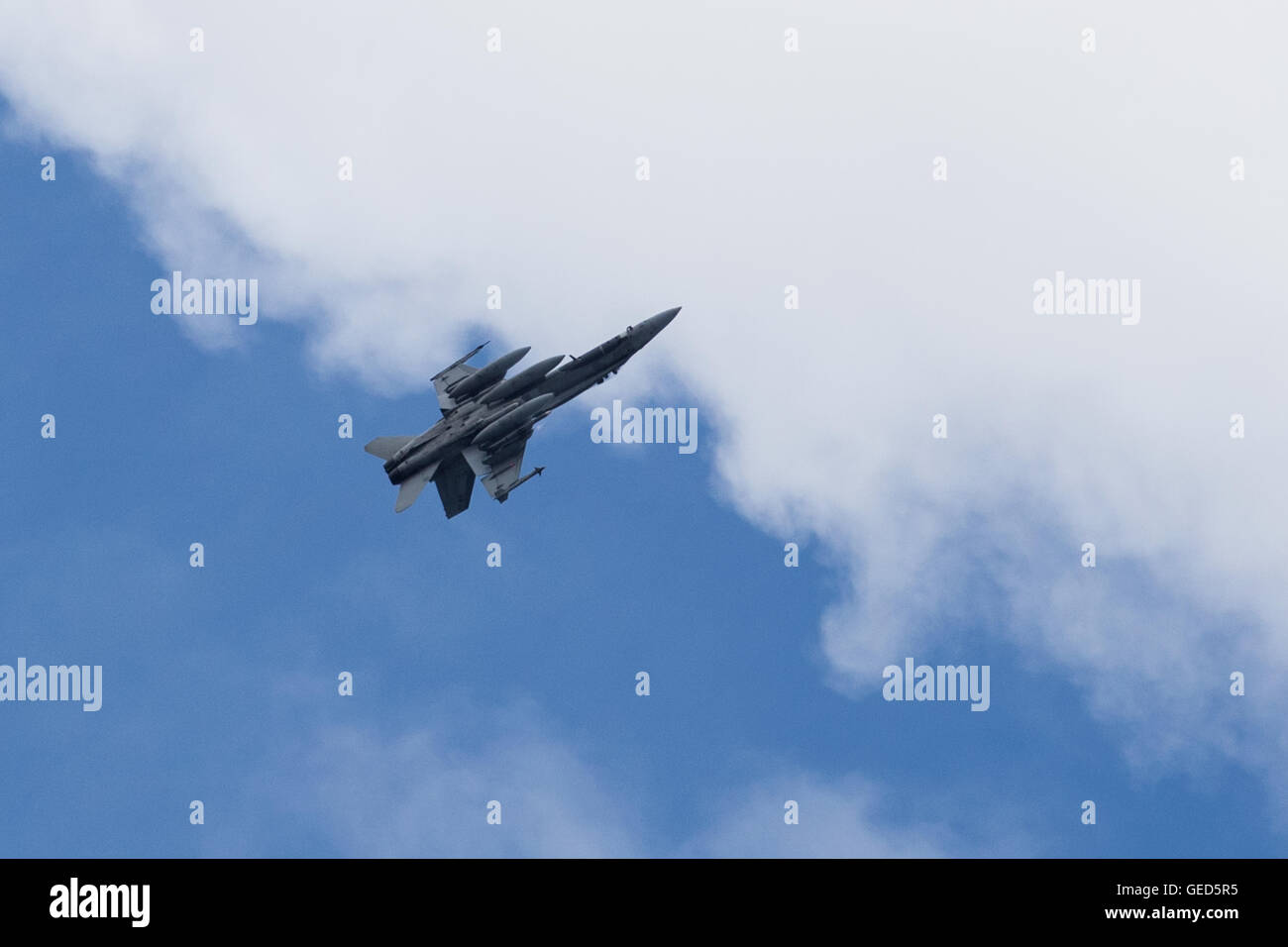 A Canadian forces CF-18 fighter jet flies over the sky in Kingston, Ont ...