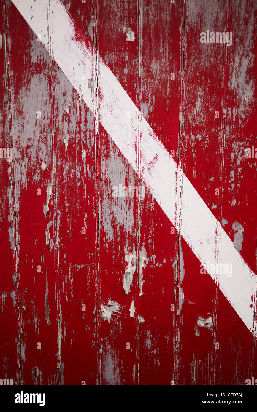 Weathered red door with white stripe in Memensha Massachusetts on ...