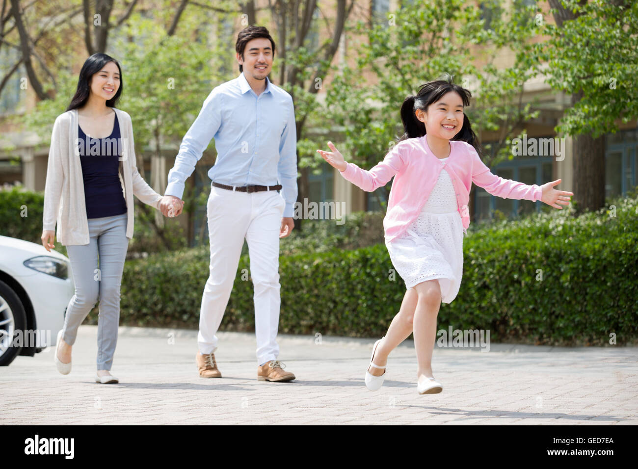 Happy young Chinese family Stock Photo - Alamy