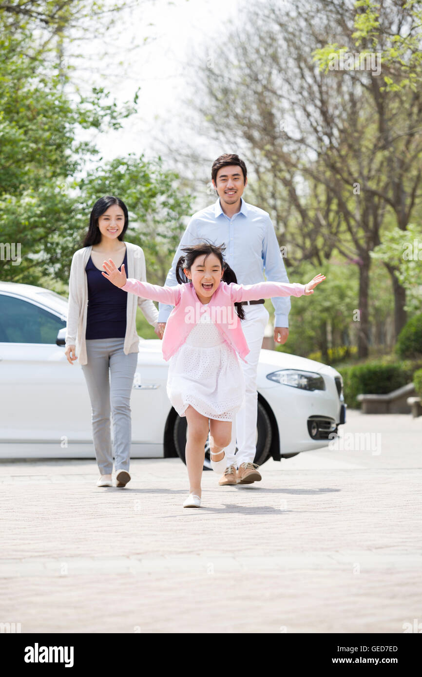 Happy young Chinese family and car Stock Photo - Alamy