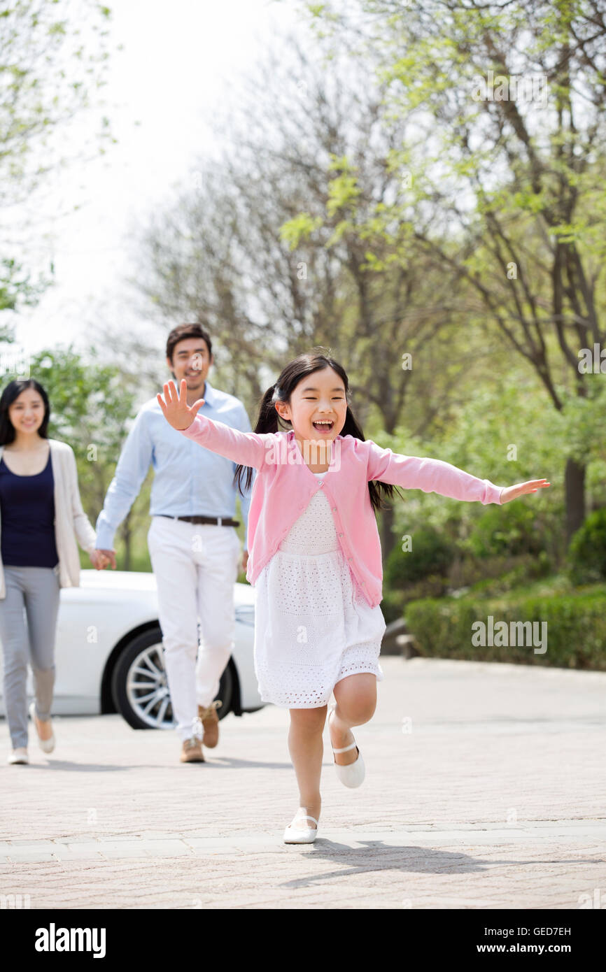 Happy young Chinese family and car Stock Photo - Alamy