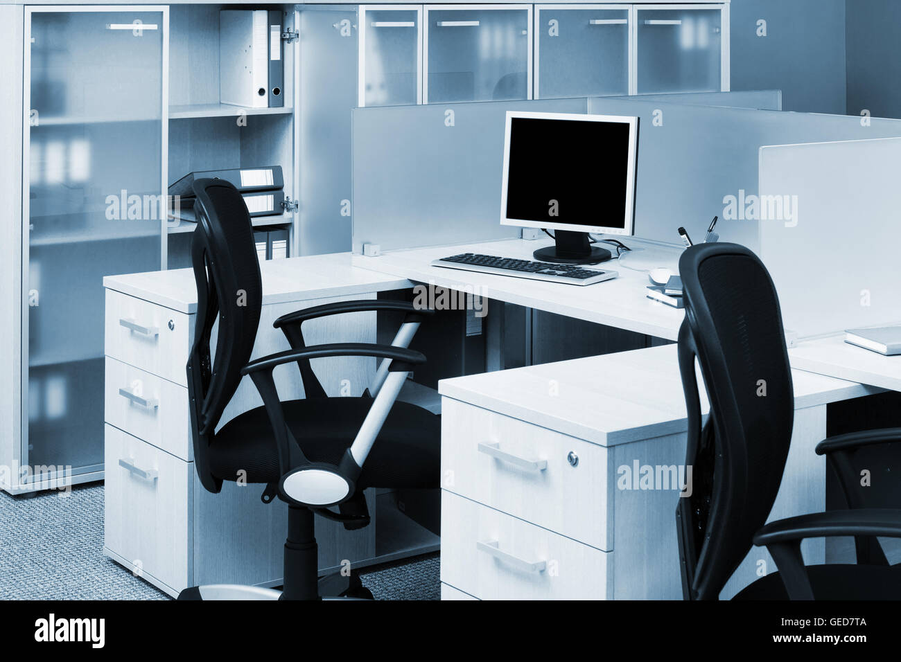 computers behind the glass in a modern office Stock Photo - Alamy