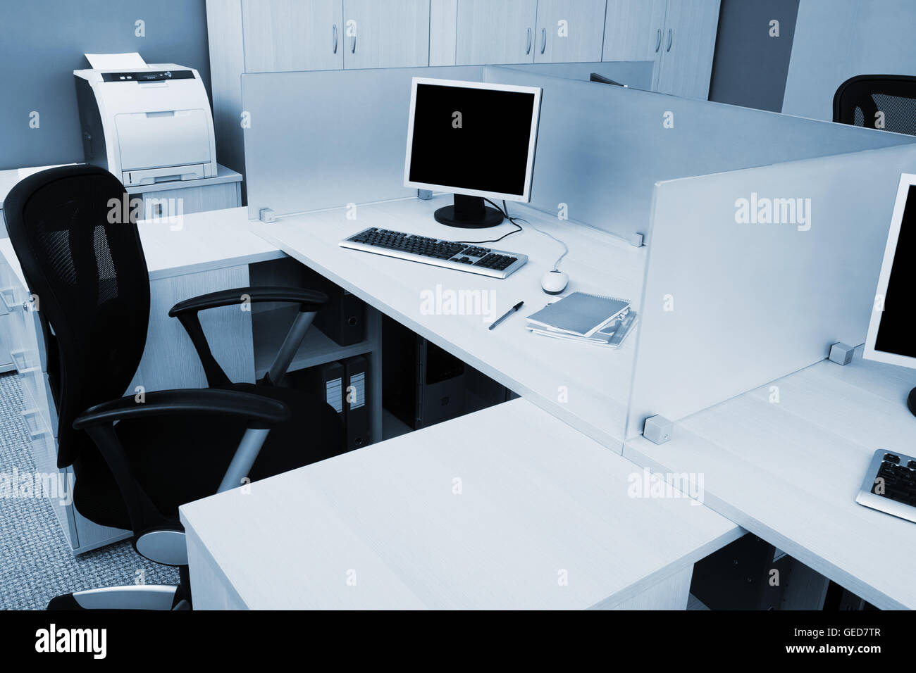 computers behind the glass in a modern office Stock Photo - Alamy