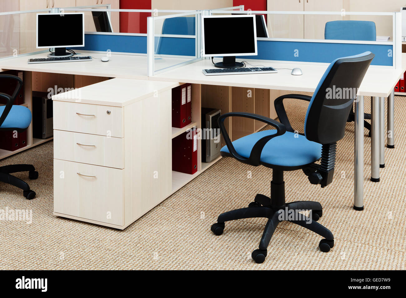 computers on a desk in a modern office Stock Photo - Alamy