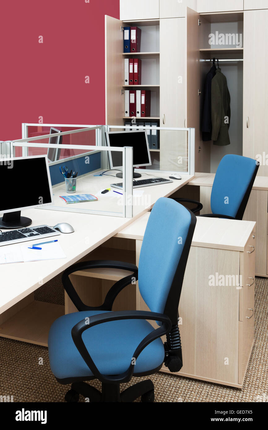 computers on a desk in a modern office Stock Photo - Alamy