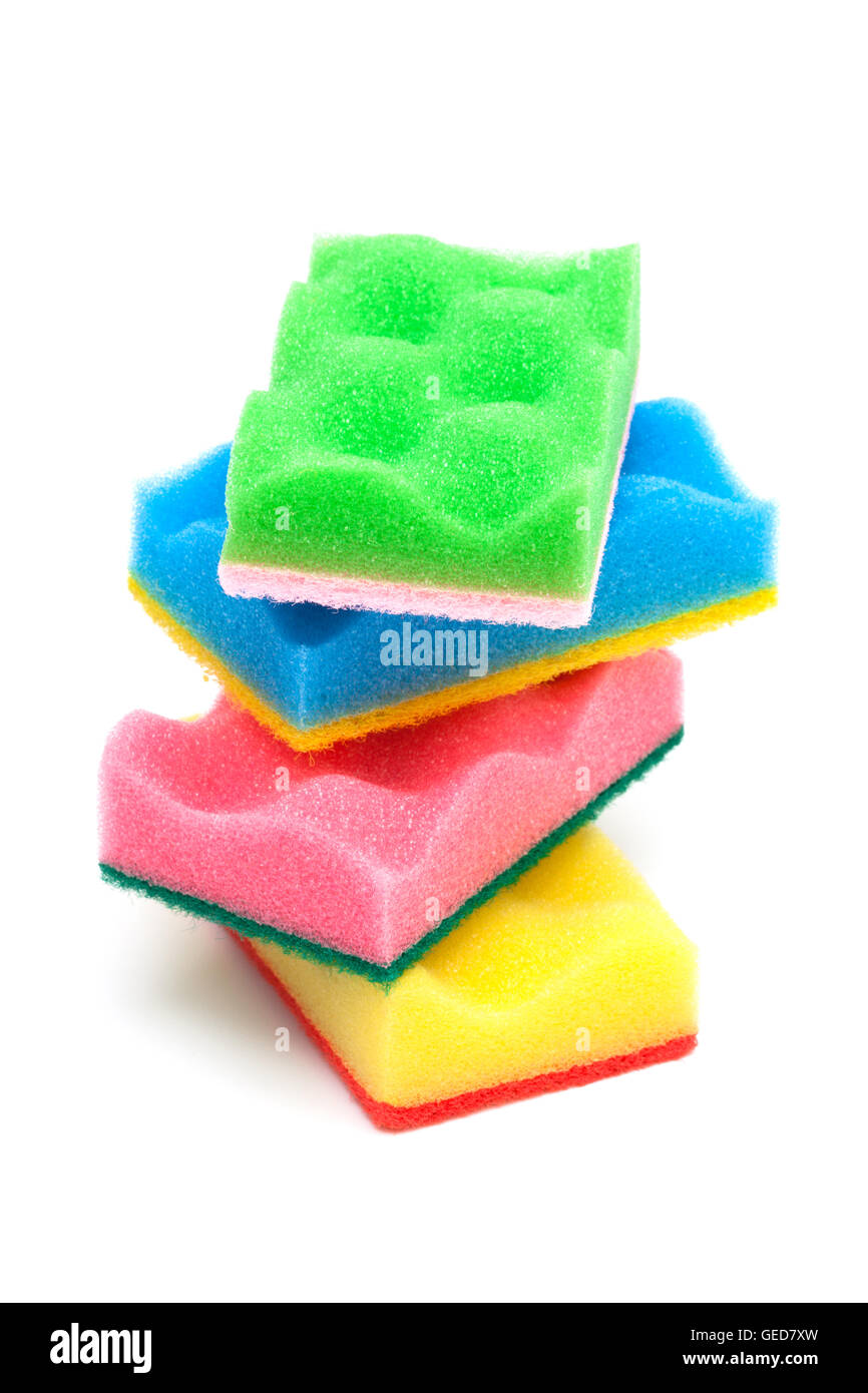 red, yellow, green and blue sponge on a white background Stock Photo ...