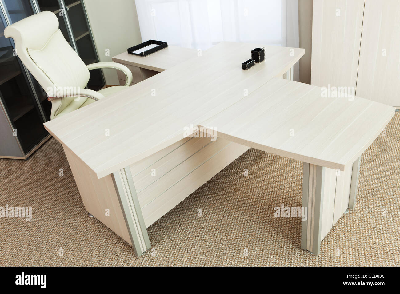white and a large desk in a modern office Stock Photo - Alamy