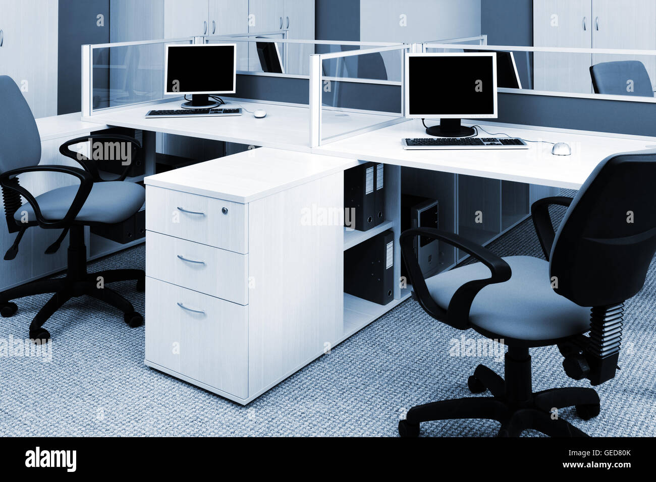 computers on the desks in a modern office Stock Photo - Alamy