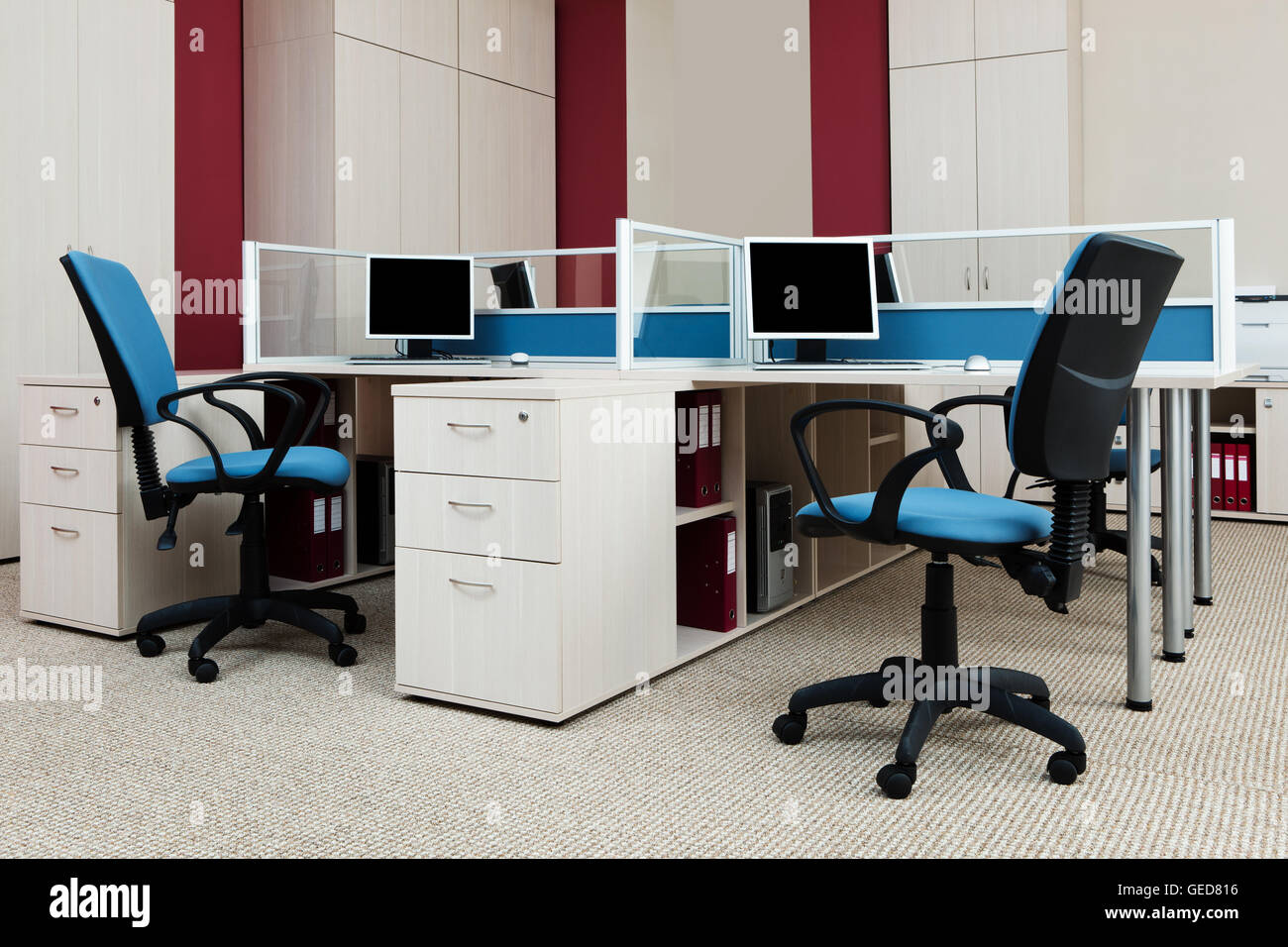 computers on a desk in a modern office Stock Photo - Alamy