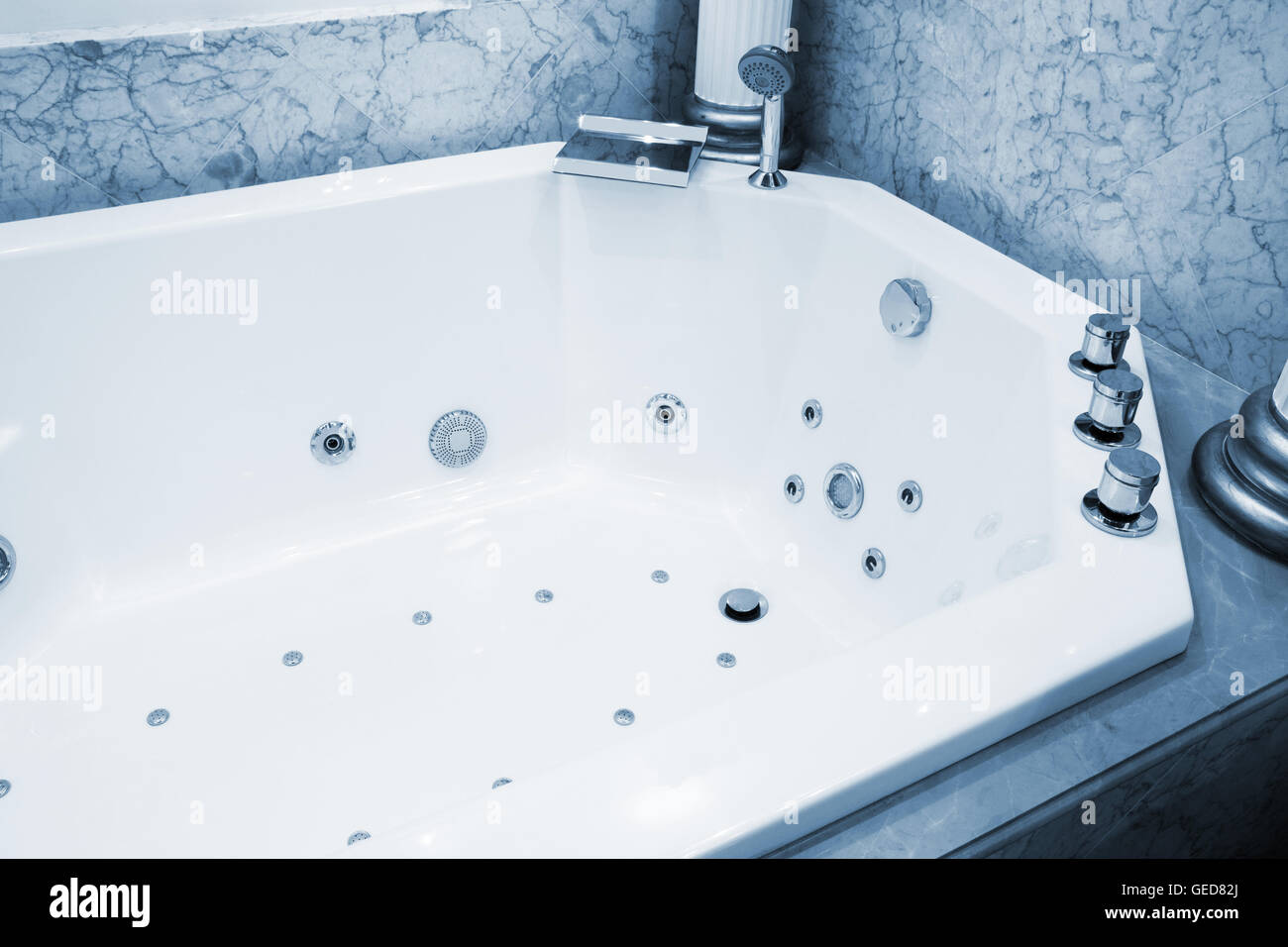 beautiful big bath in the marble bathroom Stock Photo - Alamy