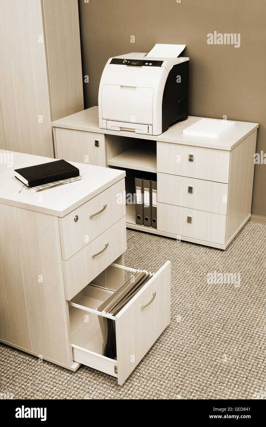 printer from the cabinet in a modern office Stock Photo - Alamy