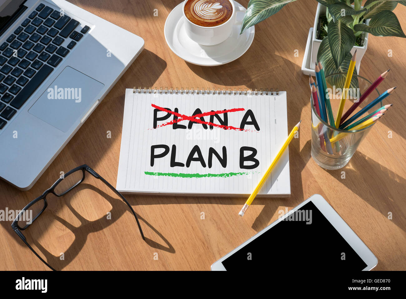 Plan B (Cross plan A, underline plan B concept) open book on table and ...