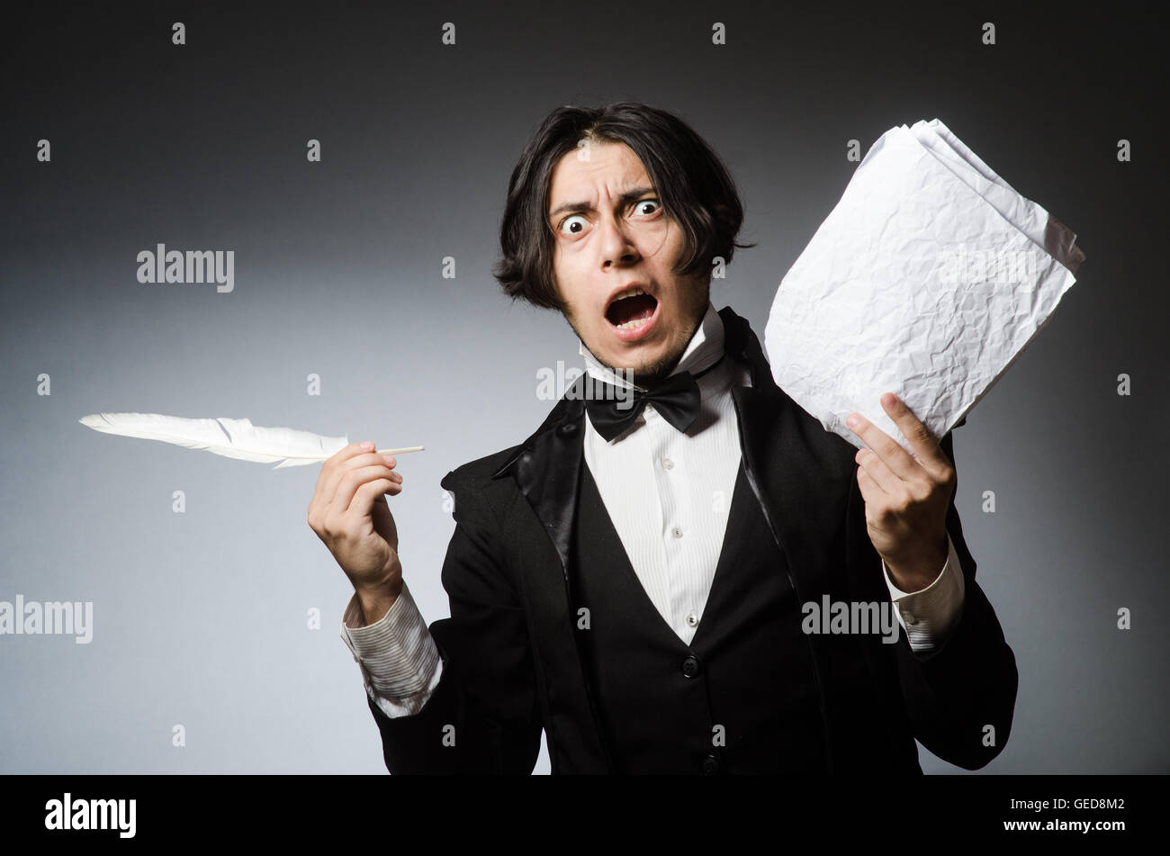Funny writer with quill in vintage concept Stock Photo - Alamy