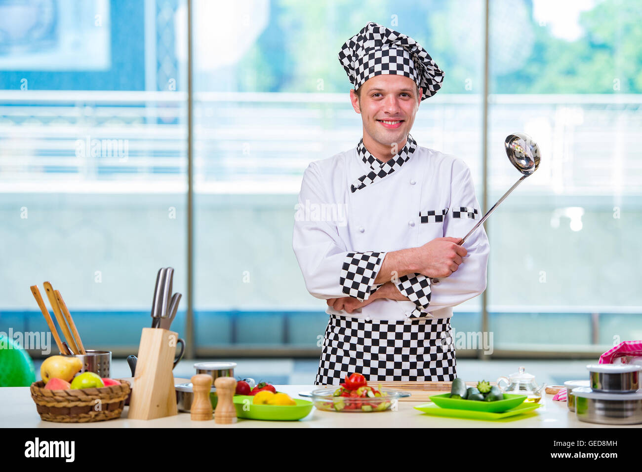 Male cook preparing food in the kitchen Stock Photo - Alamy