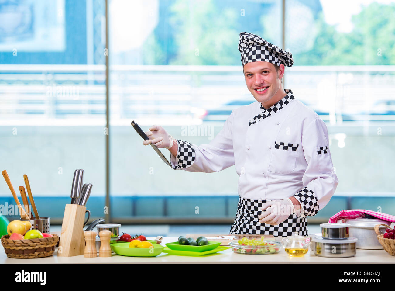 Male cook preparing food in the kitchen Stock Photo - Alamy